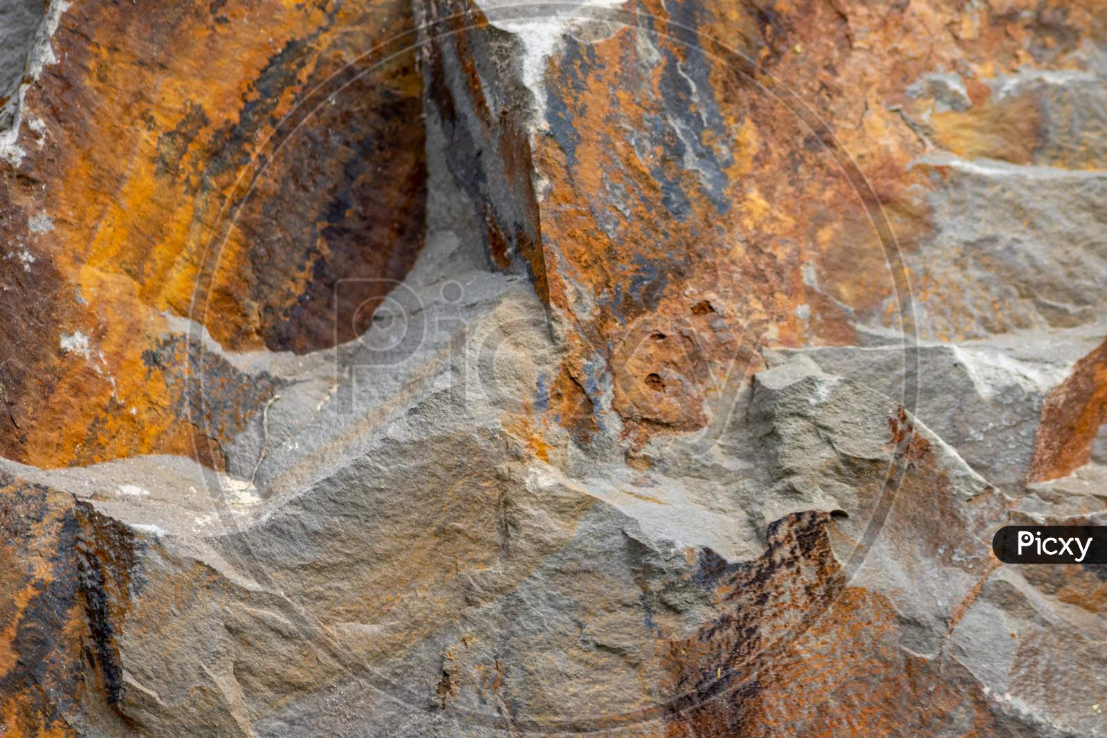Image of Raw rock in orange with minerals and metals as natural stones ...