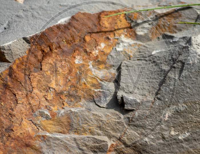 Image of Raw rock in orange with minerals and metals as natural stones ...