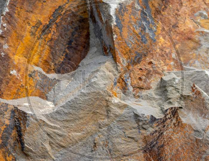 Image of Raw rock in orange with minerals and metals as natural stones ...