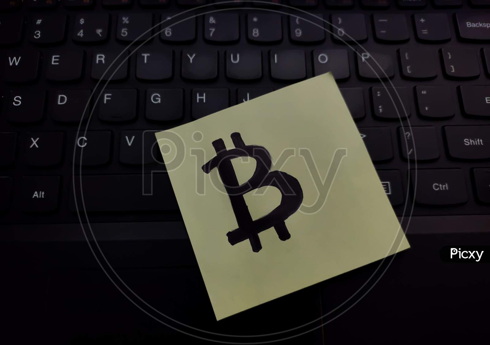 Image of Bitcoin Written On Sticky Notes Attached On Laptop-JB879032-Picxy