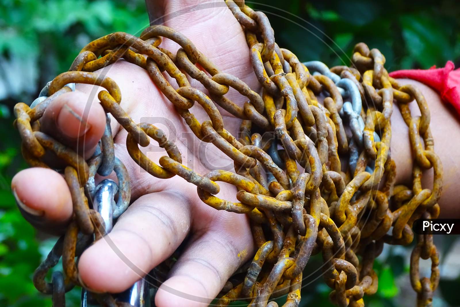 Image of Hands with chain wrapped around them-TQ621543-Picxy