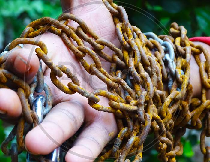 Image of Hands with chain wrapped around them-TQ621543-Picxy