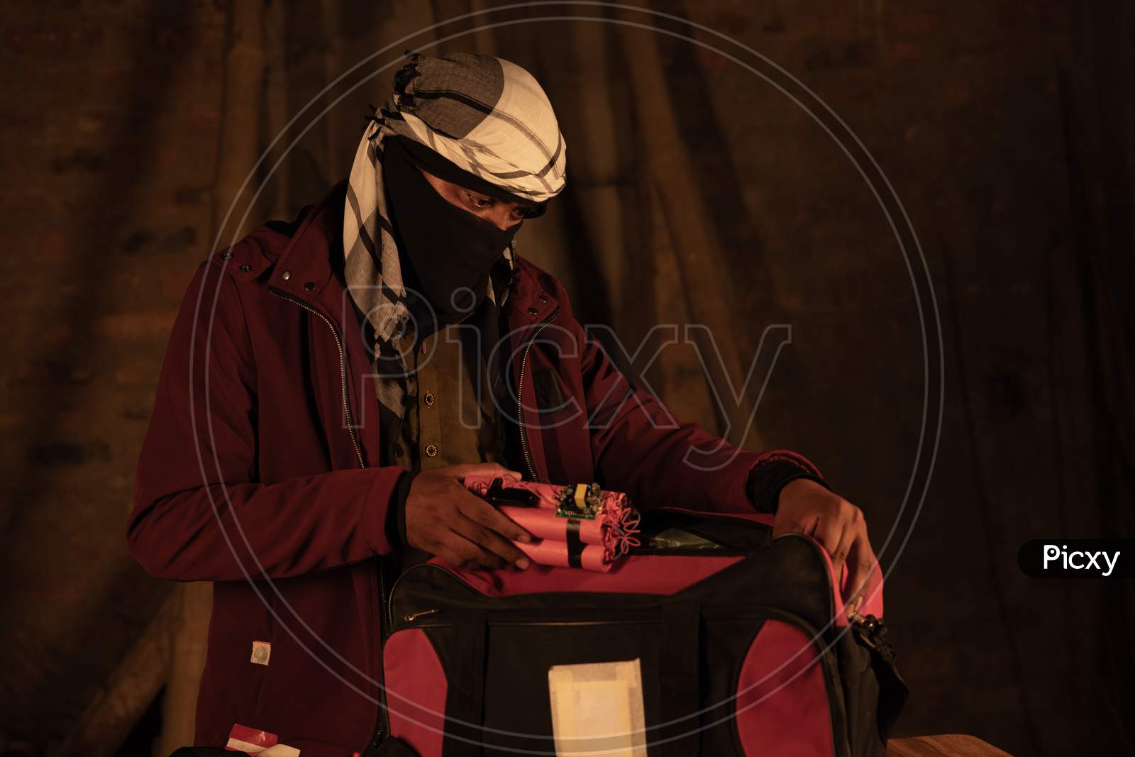 Image of Muslim Militent Or Soldier With Face Cover Placing Time Bomb ...