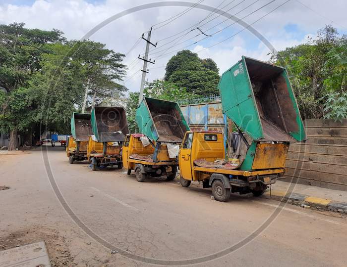 Image of Closeup of BBMP empty auto rickshaw container parking on ...