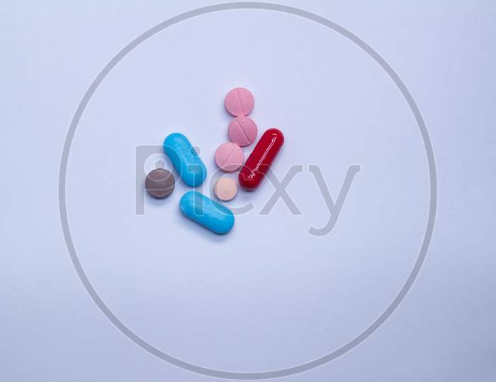 Image of Colored Pills On A White Background. Medicines Or Legal Drugs ...