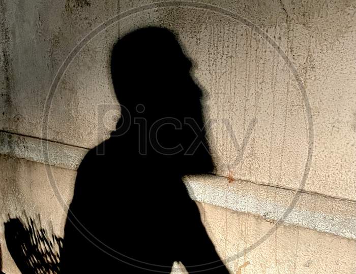 Image of shadow of a beard man on the wall-NG475263-Picxy