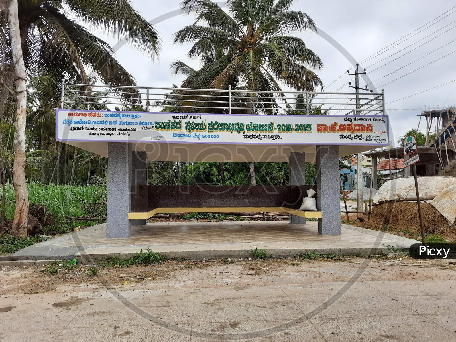 Image of Closeup Of Indian Village Super Bus Stop And Concrete Road ...