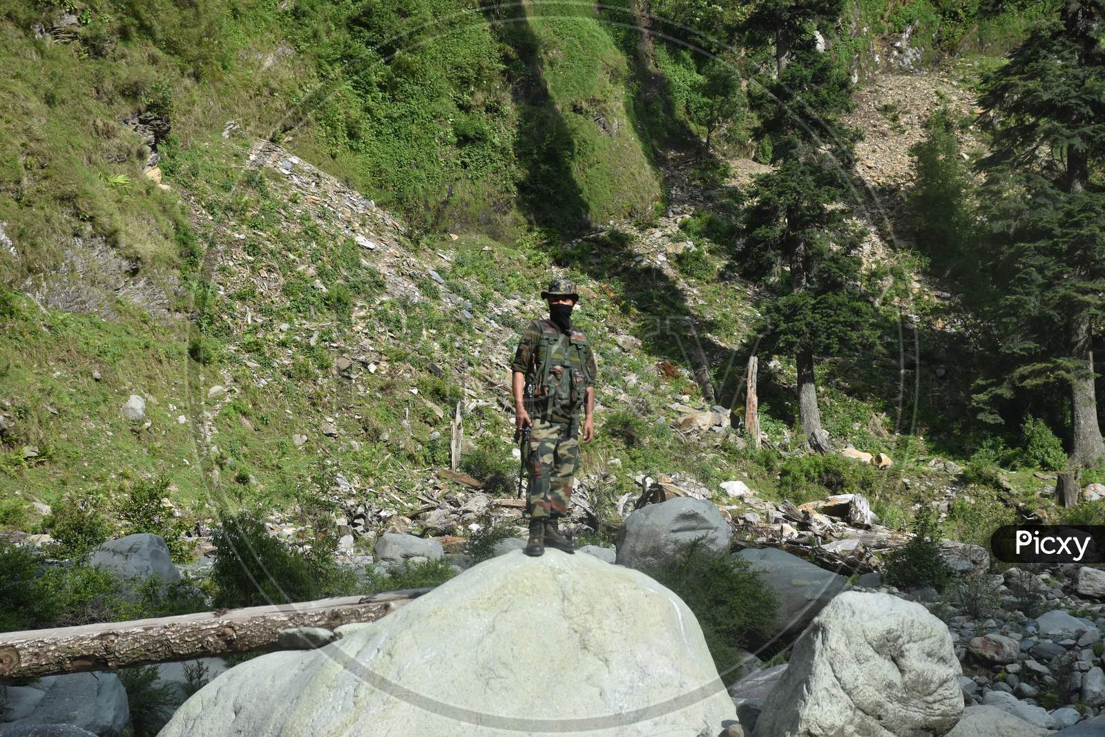 Image of Army jawan stand after crossing hand made wooden bridge near ...