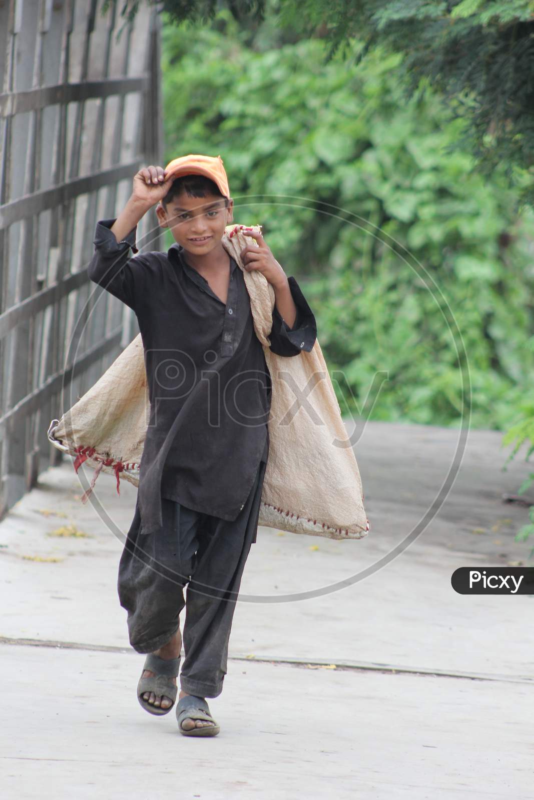 Image of A Boy Carrying A Garbage Bag To Sell, The Lives And Lifestyles ...