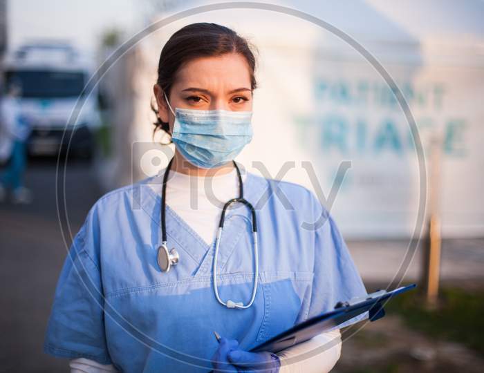 Image of Portrait Of Very Tired & Exhausted Uk Nhs Icu Doctor In Front ...