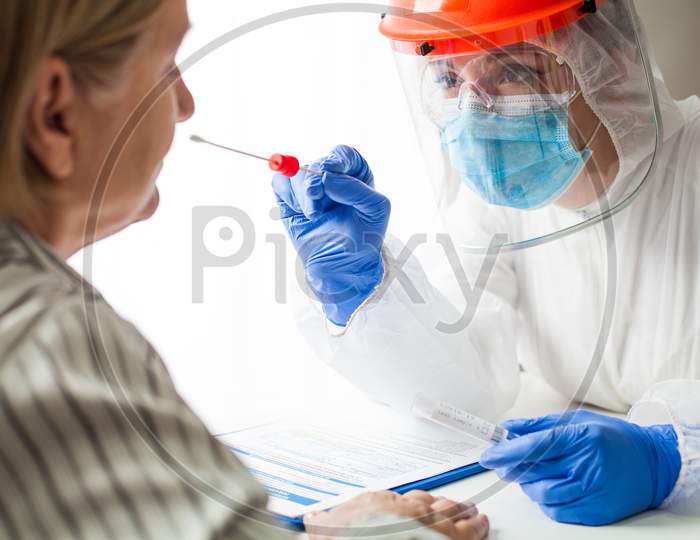 Image of Physician Wearing Personal Protective Equipment Performing A ...