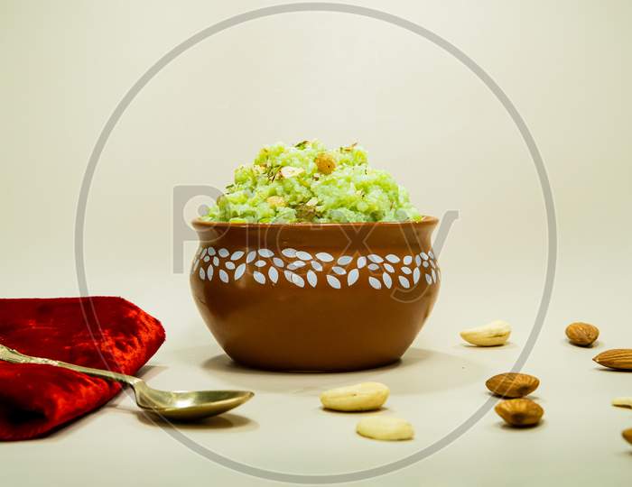 Image of Front View Of Indian Sweet Dudhi Ka Halwa In Matka With ...